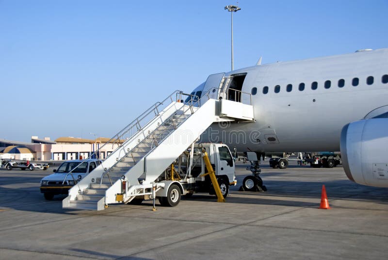 Loading cargo on a plane stock photo. Image of arrive - 13398314