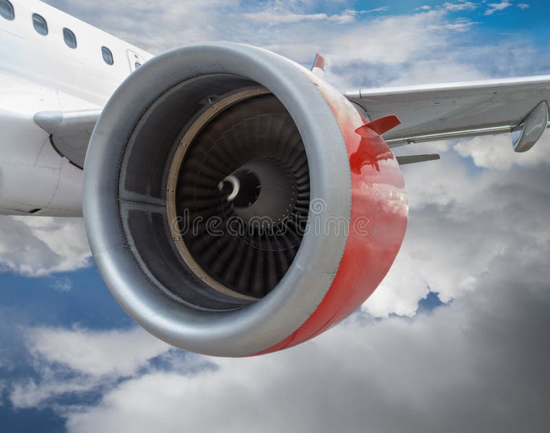 Airplane with Red Engine Flying in the Clouds Stock Image - Image of ...