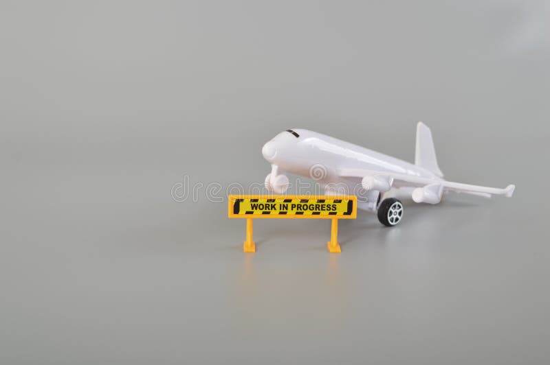 Airplane and Road Sign with Text WORK in PROGRESS Stock Photo - Image ...
