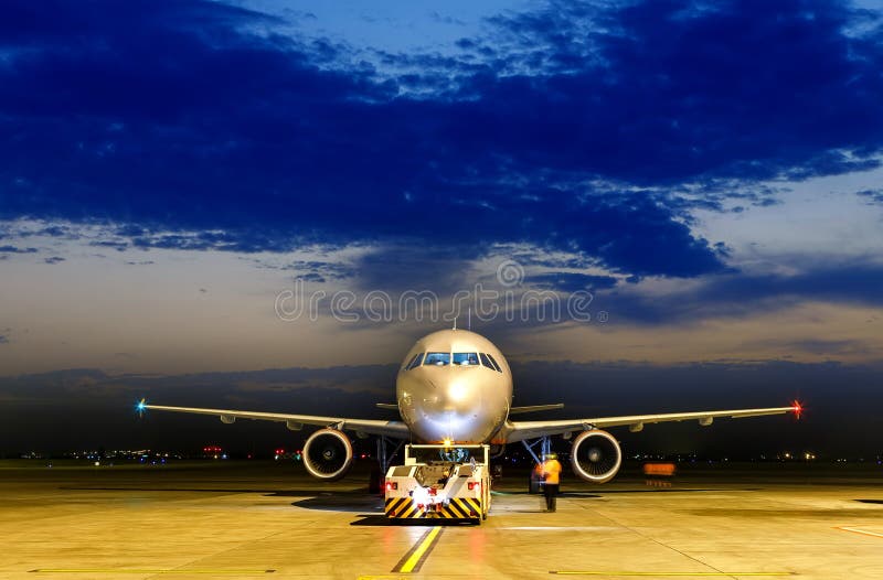 Airplane on Runaway during Sunset Commercial Airplane at Night. Front ...