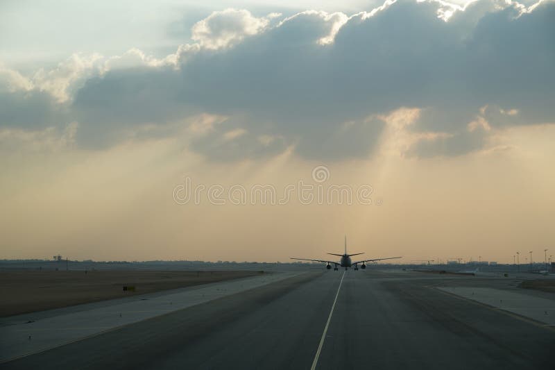 Airplane on Runway at Sunset Stock Photo - Image of transportation ...