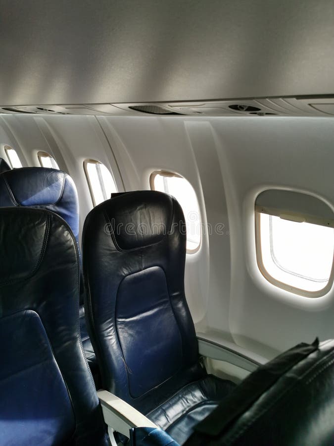 Airplane Seat Next To an Airplane Window Stock Photo - Image of ...