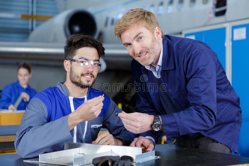 Airplane Service Crew Looking at Camera Stock Photo - Image of hangar ...