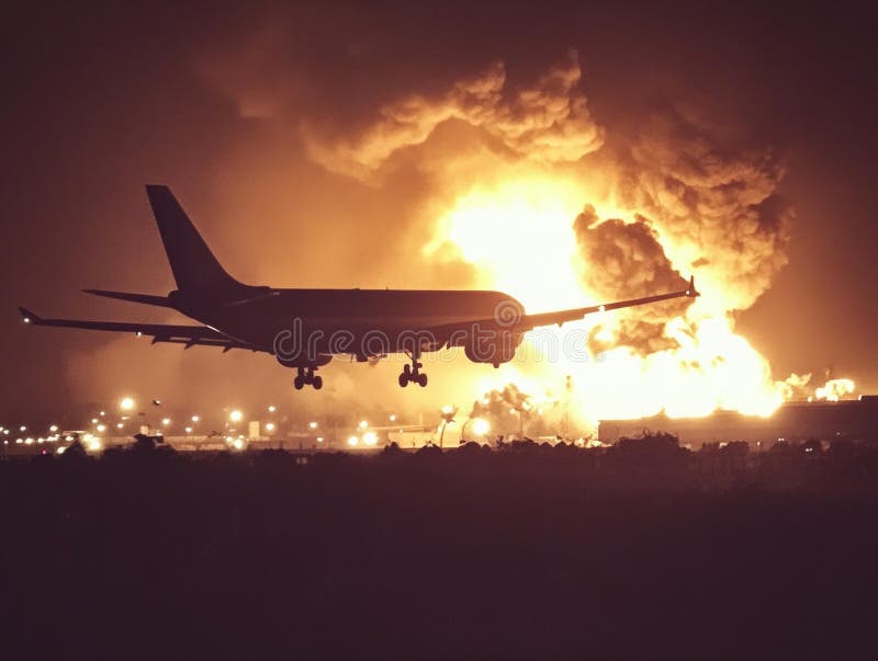 Airplane Silhouette Against Dramatic Fire and Smoke at Night Stock ...
