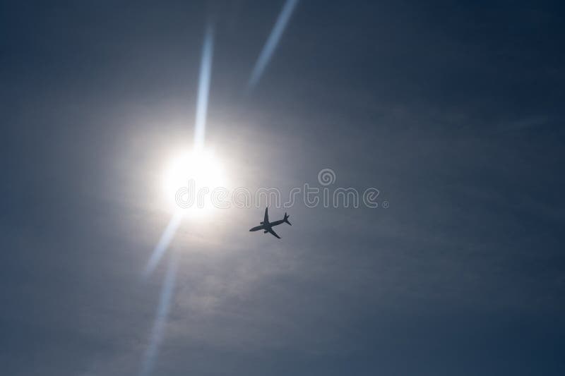 An Airplane in the Sky with Sun Stock Image - Image of travel, traffic ...