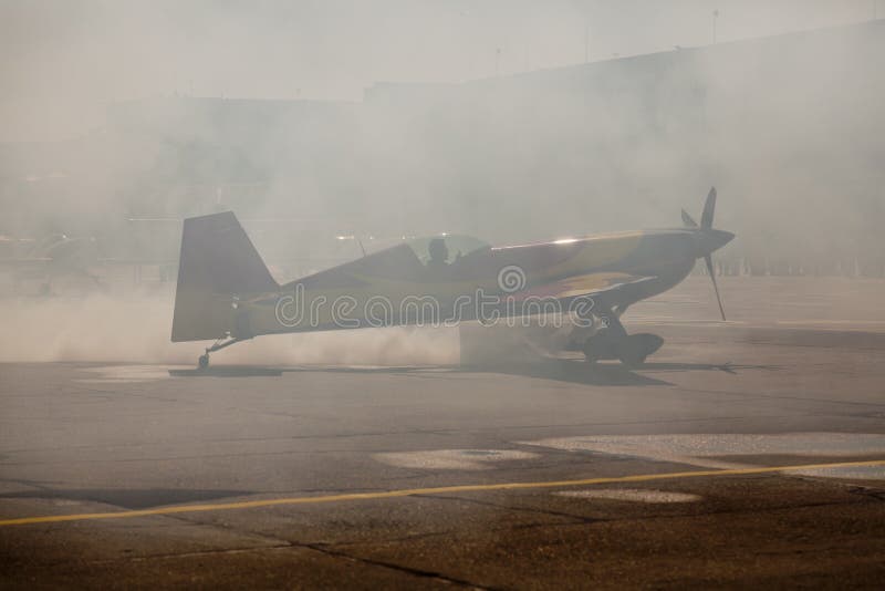 Airplane in Smoke on the Ground Stock Photo - Image of demonstration ...