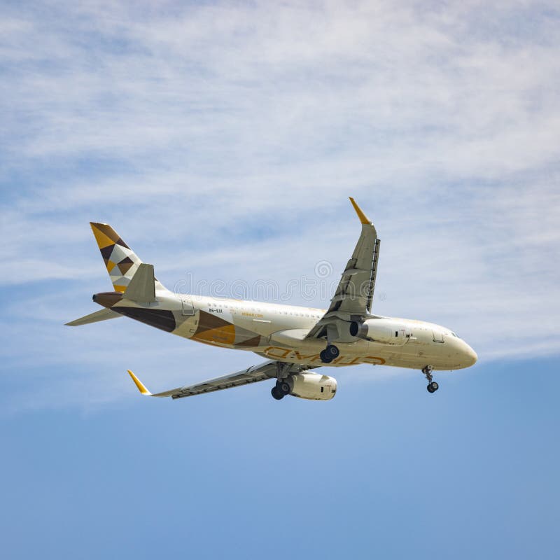An Airplane Flying High in the Sky with Blue Skies Above Editorial ...