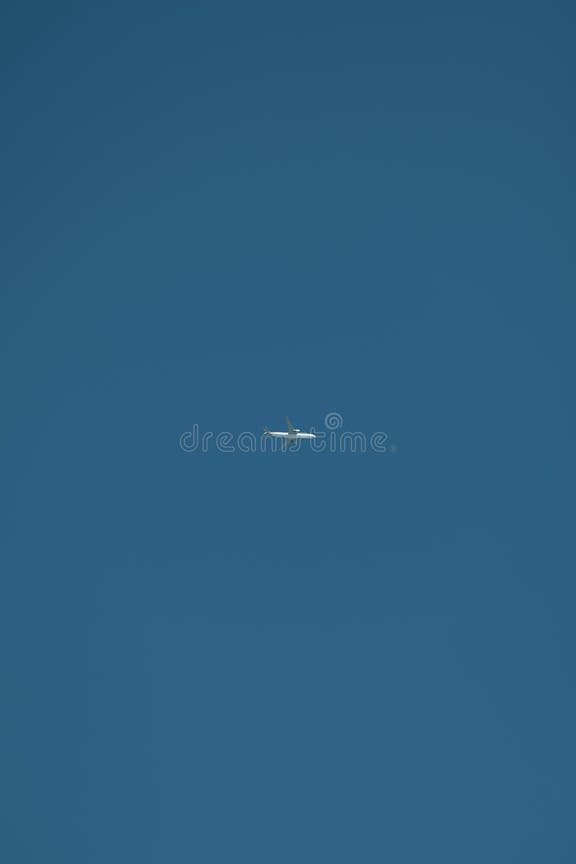 Airplane Soaring High in the Sky. Stock Photo - Image of vertical, view ...