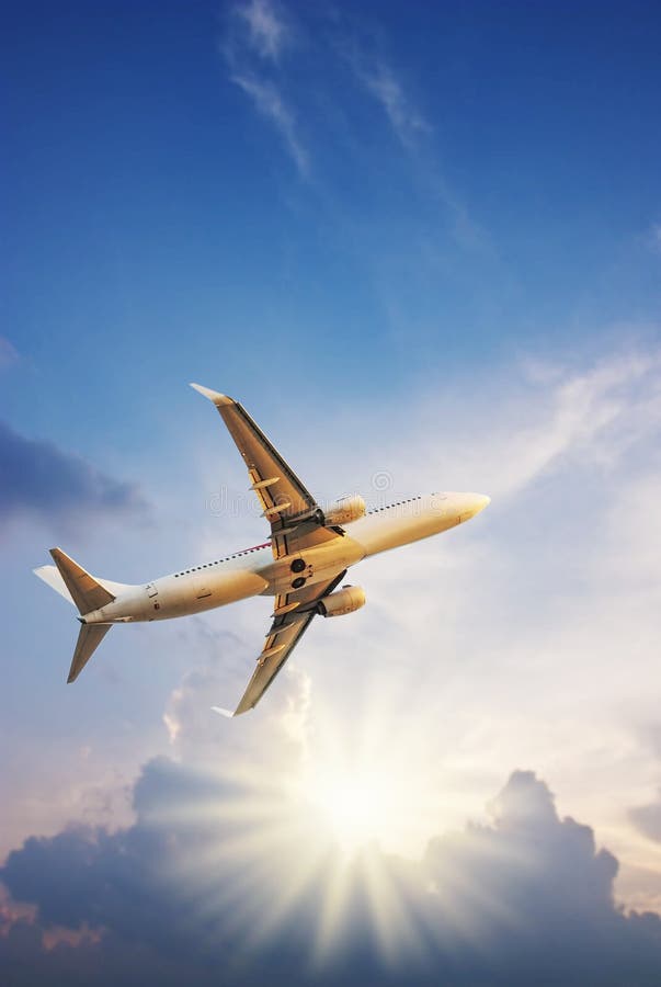 Airplane with Sun Ray on Blurred Sky Stock Image - Image of dramatic ...