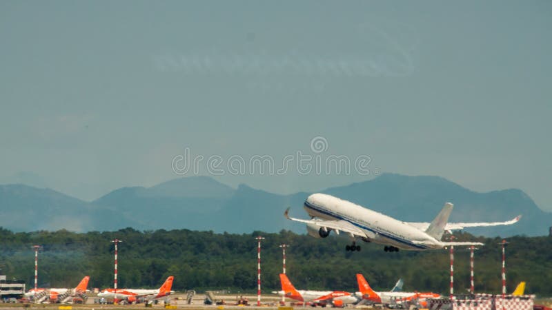 Airplane Taking Off the Ground Captured in a Dull Cloudy Weather Stock ...