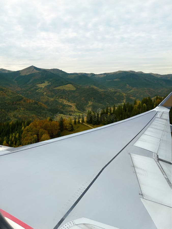 Airplane Taking Off or Landing, View on Mountains from Window Stock ...