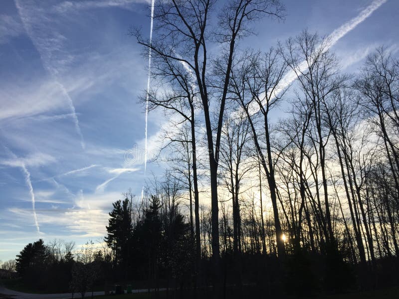 Airplane Tracks in a Clear Sky Stock Photo - Image of tracks, sets ...
