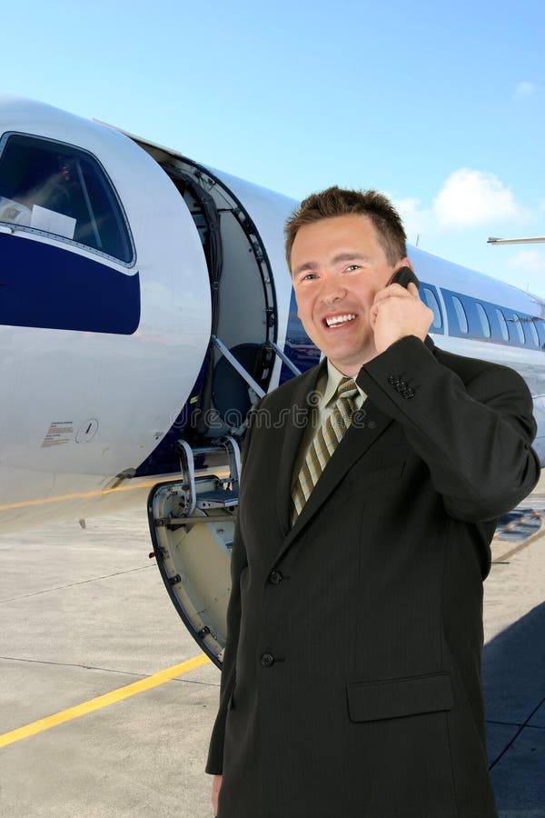 Businessmen Shaking Hands in Front of Corporate Je Stock Photo - Image ...