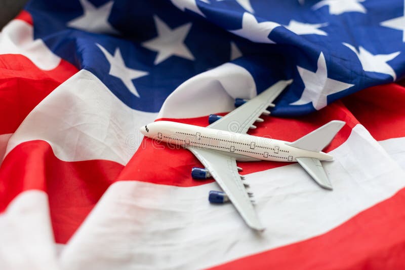 Airplane on the Usa Flag As a Symbol of Passenger Transportation Stock ...