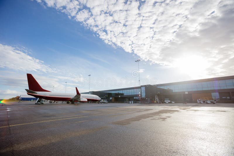 Airplane on Wet Runway Against Sky Stock Image - Image of outdoor ...