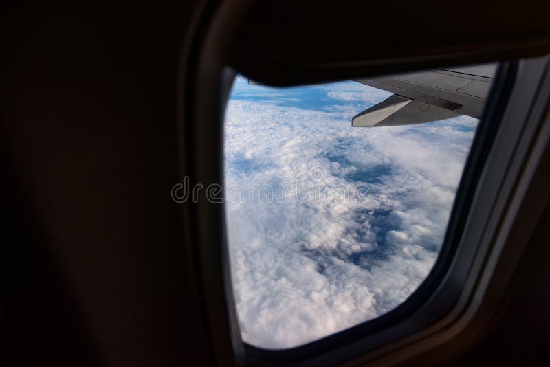 Airplane Window from Inside. through the Window You Can See Clouds ...