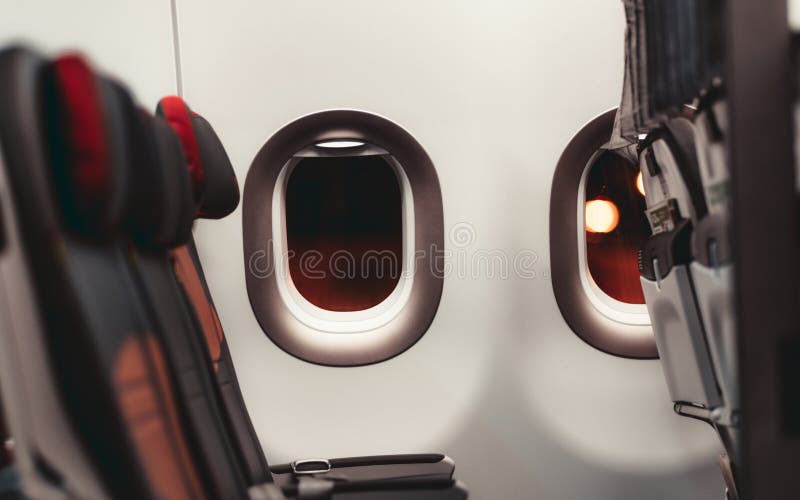 Airplane window and seats stock image. Image of bokeh - 156387827