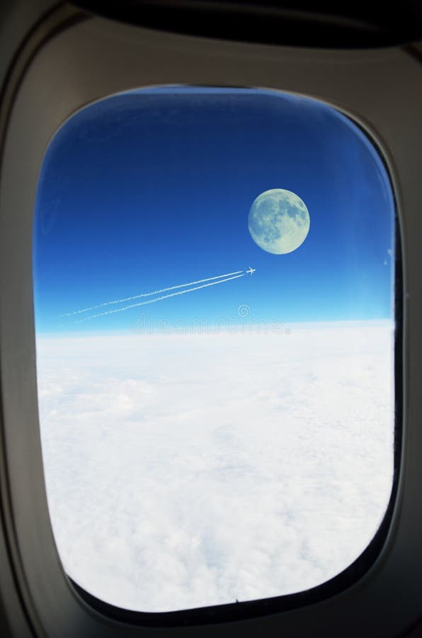 Airplane Window with View with Full Moon and an Airplane in Flight ...