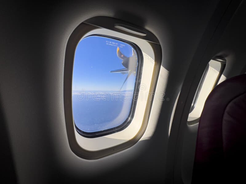 Airplane Window View with Reflection and Clouds Stock Photo - Image of ...