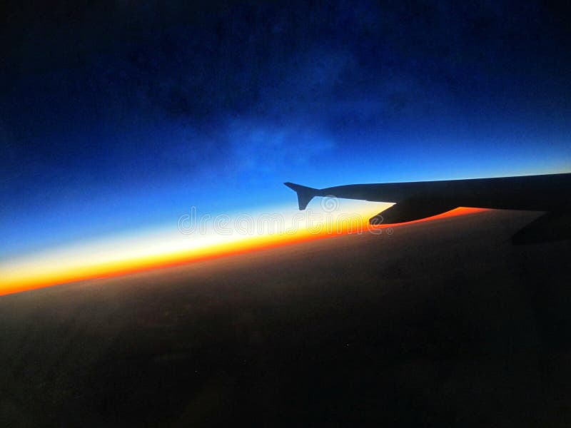 Airplane Window View at the Time of Sunset. Stock Photo - Image of ...