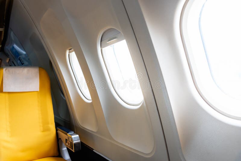Airplane Window with Yellow Color Empty Airplane Seat Stock Image ...