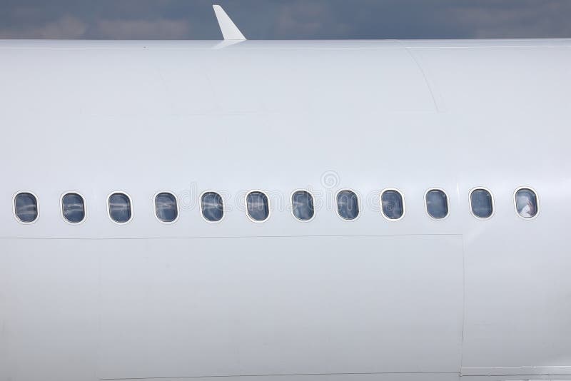 Airplane windows, close-up stock photo. Image of aircraft - 132169600
