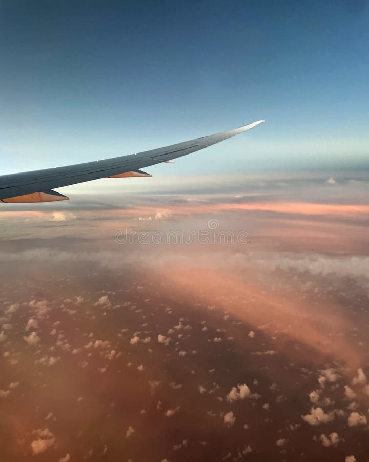 Airplane Wing Above the Clouds, Pink and Blue Stock Photo - Image of ... Airplane Wing Above the Clouds, Pink and Blue Stock Photo - Image of ...