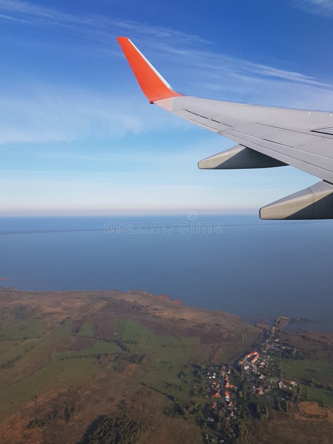 Airplane wing in blue sky stock photo. Image of nature - 199125814