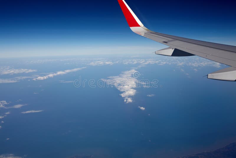 Airplane wing and blue sky stock photo. Image of elevation - 40389414
