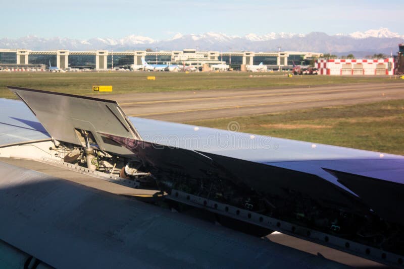 Detail of the Wing of an Airplane with the Flaps in Motion during the ...