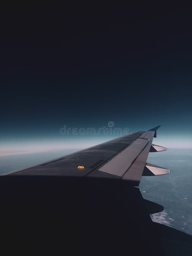 Airplane wing in flight. stock photo. Image of airliner - 234432810