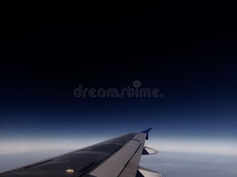 Airplane wing in flight. stock photo. Image of airliner - 234432810