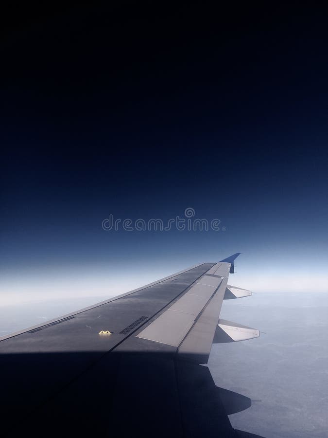 Airplane wing in flight. stock photo. Image of aviation - 234432798