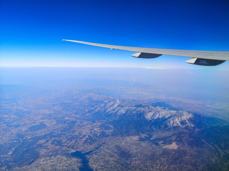 Airplane wing in flight stock photo. Image of airplane - 182418116
