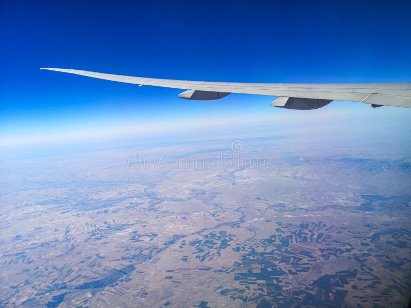Airplane wing in flight stock image. Image of view, nature - 182418117
