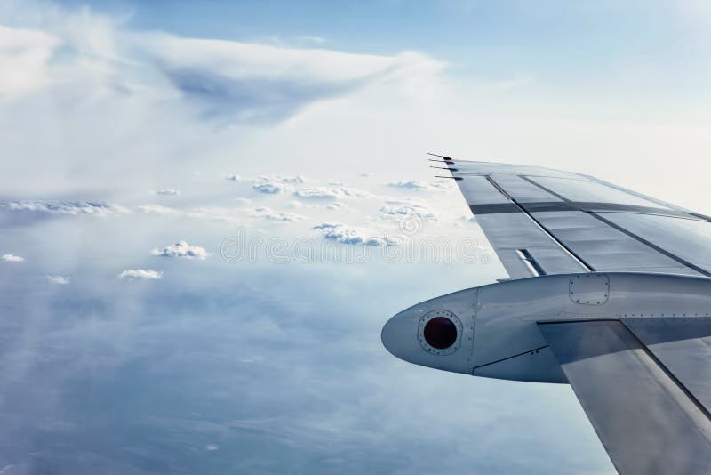 Airplane Wing in Flight stock photo. Image of skyline - 76665494