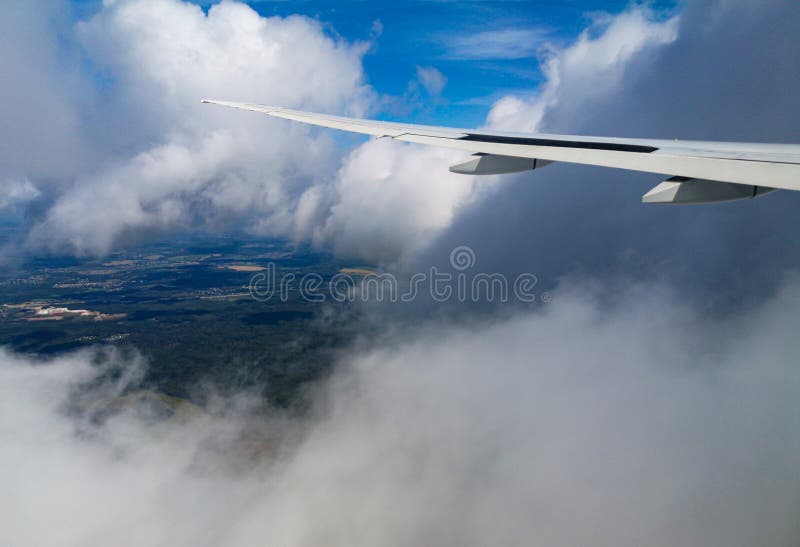Airplane wing in flight stock photo. Image of airplane - 193790670