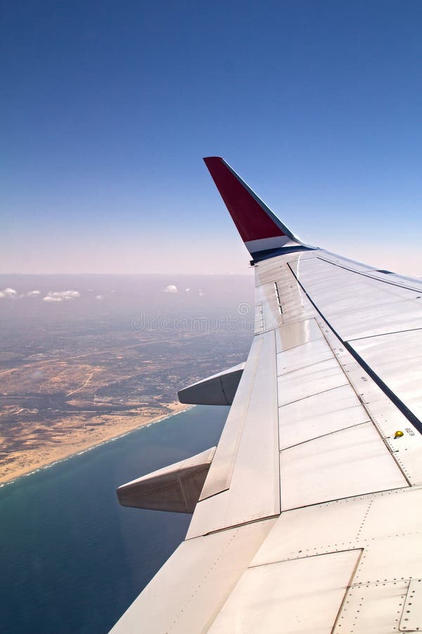 Airplane Wing Flying Above the Seashore. Stock Image - Image of airport ...