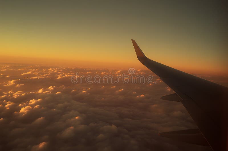 Airplane Wing Flying Over Sunset Cloudscape, View from Window ...