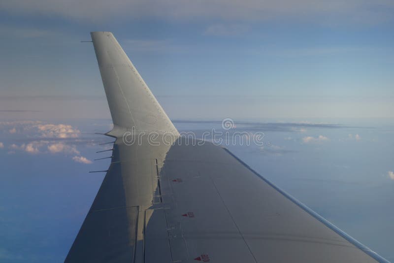 Airplane Wing at High Altitude in Flight Stock Photo - Image of silver ...