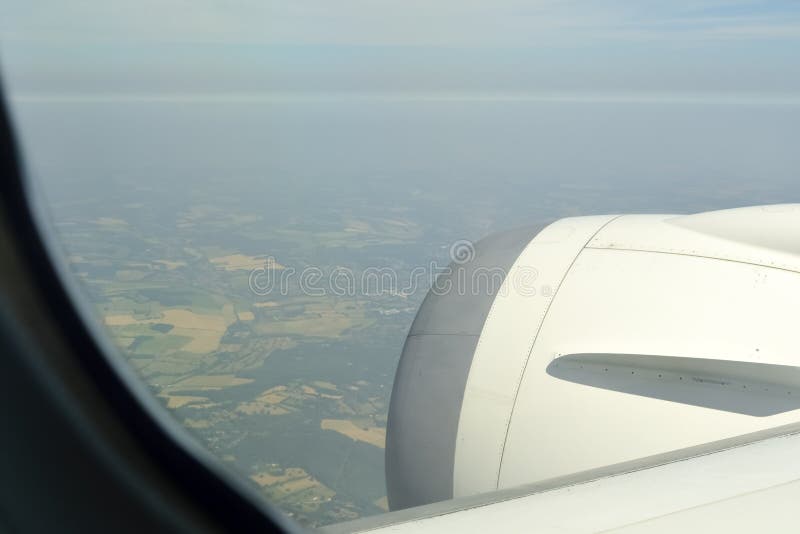 Airplane Wing in mid sky stock photo. Image of high - 125683592