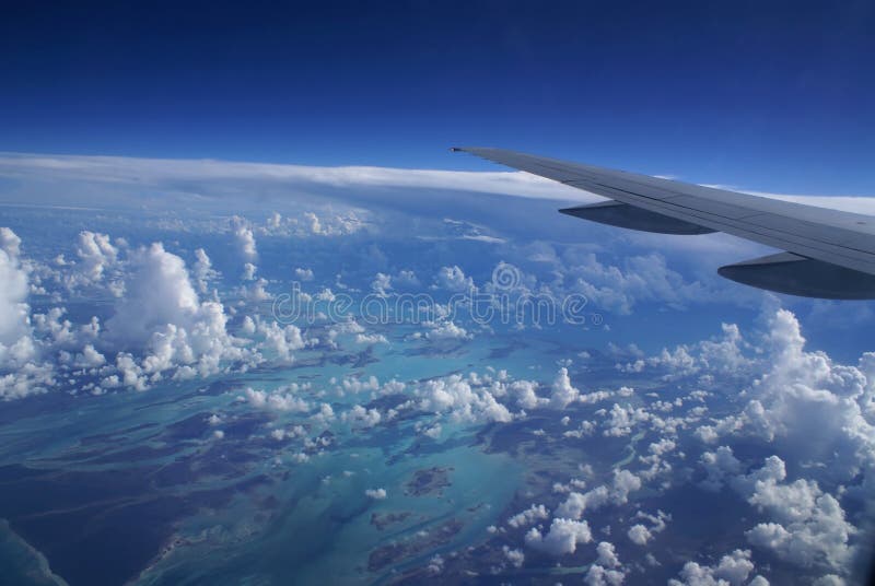 Airplane Wing over clouds stock photo. Image of wing, white - 1336160