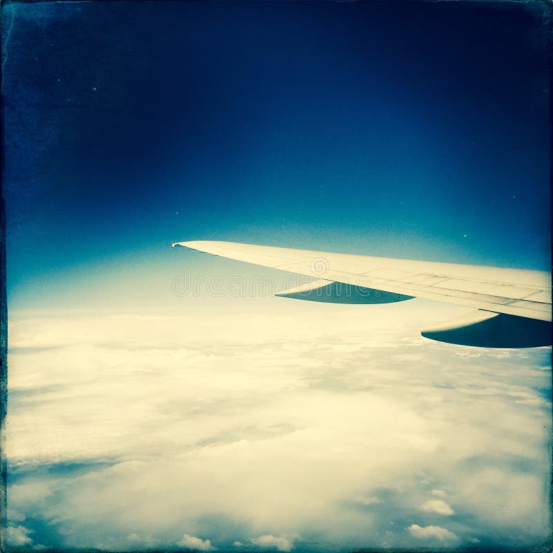 Airplane wing over clouds stock image. Image of transportation - 71935431