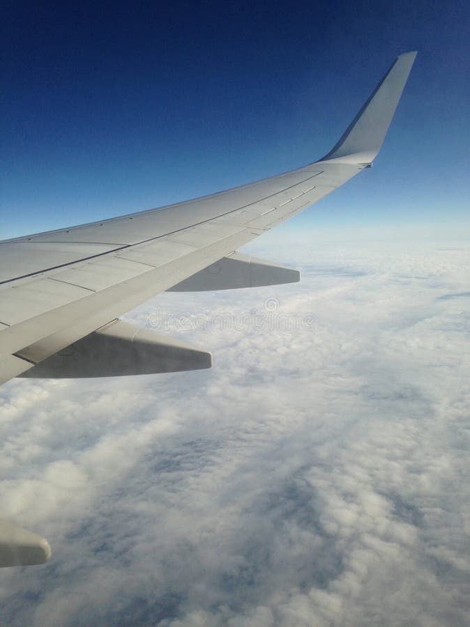 Airplane Wing Over the Clouds. Stock Photo - Image of heaven, aircraft ...