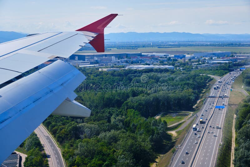 Airplane Wing during Plane Low Flight Above Highway, while in Descent ...