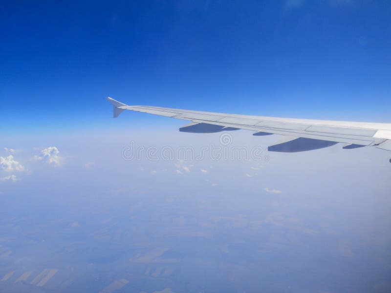 Airplane Wing in Sky in Flight. Stock Image - Image of horizon, earth ...