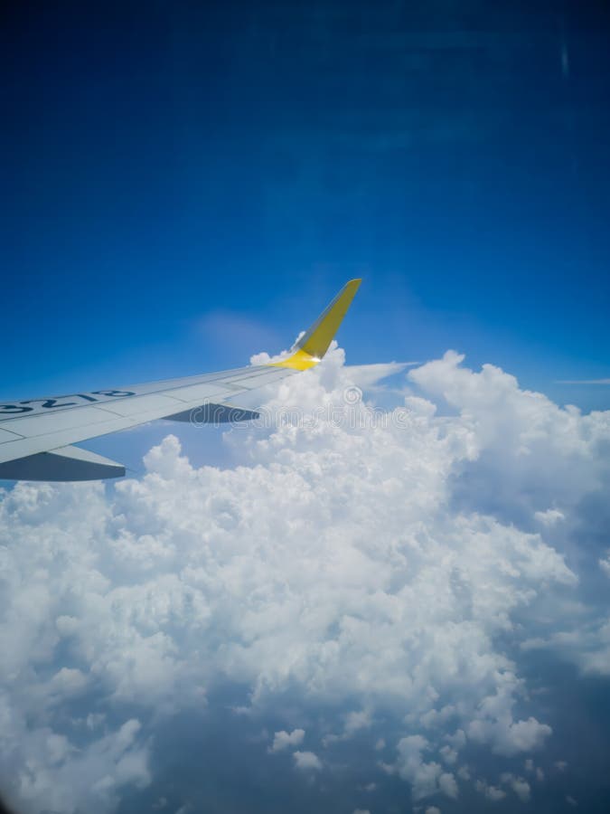 Airplane Wing Soaring Above the Clouds Inside Cebu Pacific Plane ...