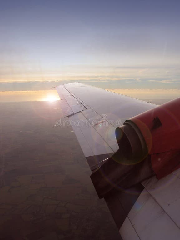 Airplane Wing with Sun Flare Stock Image - Image of wing, flying: 1046063