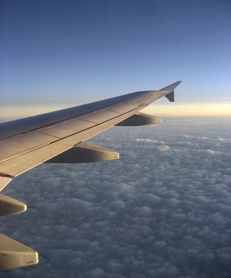 Airplane wing on sunset stock image. Image of outside - 13539219