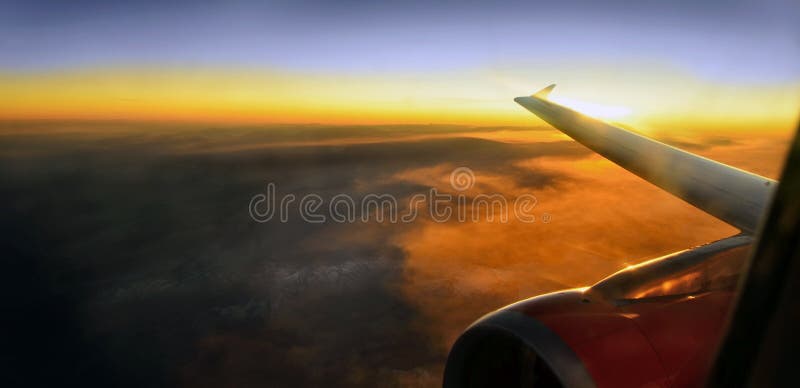 Wing of an Airplane Flying at Sunset. Stock Photo - Image of aircraft ...